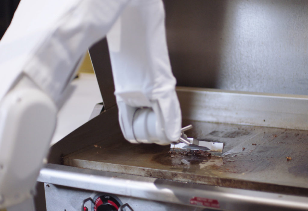 First major fast food chain to test robot chef explains its kitchen ...